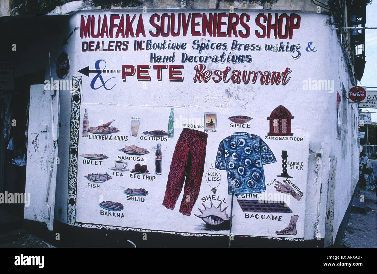 A colourful sign painted on a shop wall in the stone town Zanzibar ...