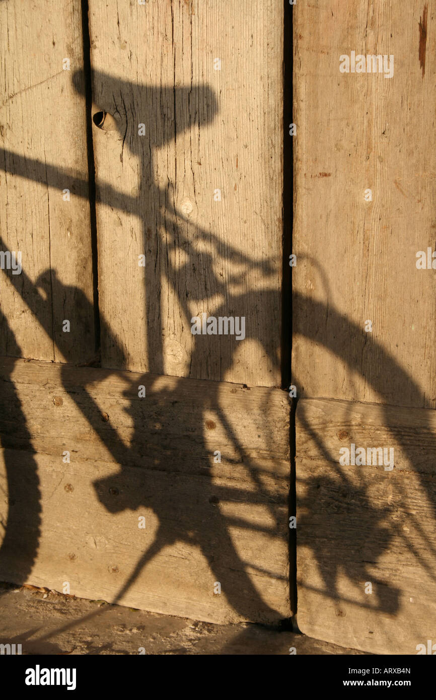 bike shadow on wooden door Stock Photo - Alamy