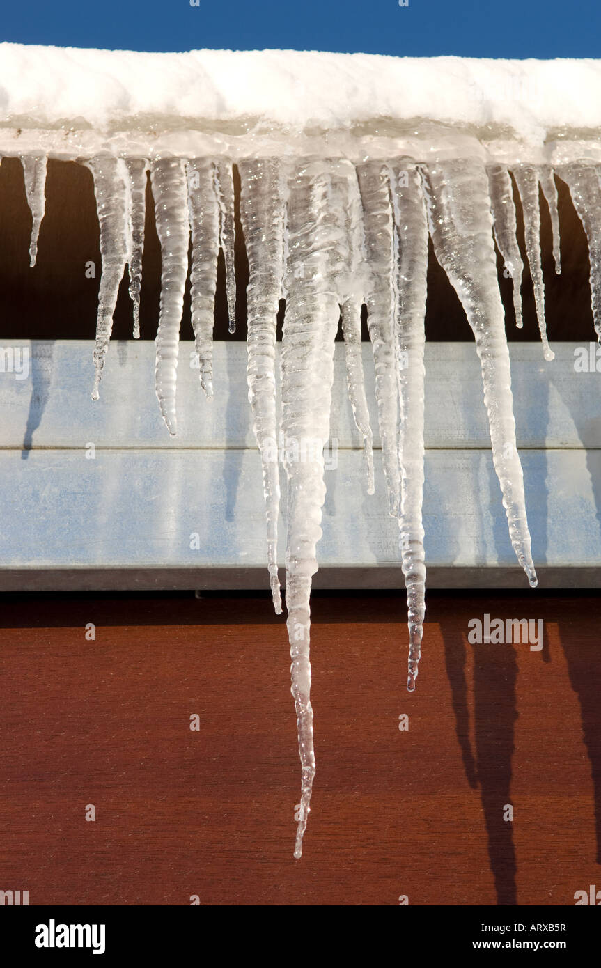 Ice hanging from roof Stock Photo - Alamy