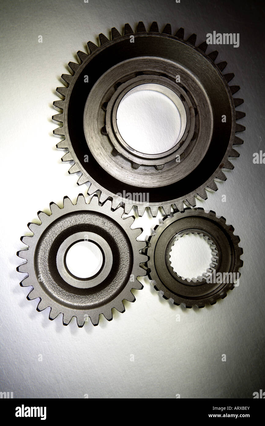 Three steel gears meshing together Stock Photo - Alamy