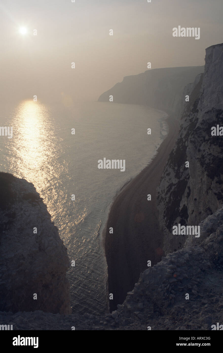 Sunset over the Dorset coast Stock Photo - Alamy