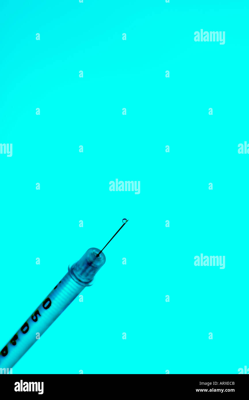 syringe close up with drop of serum at tip Stock Photo - Alamy