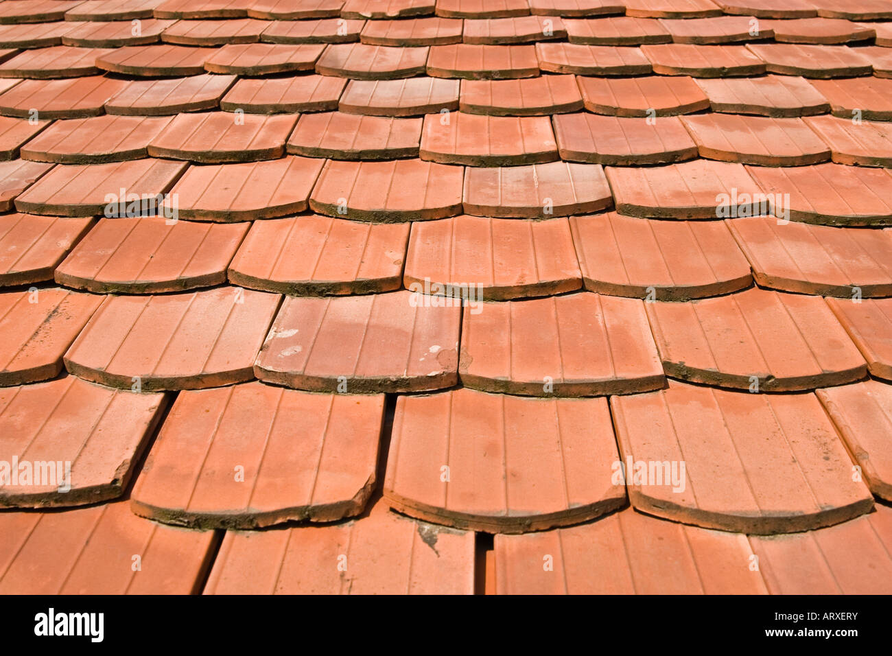 Red clay roofing tiles close-up, German slate style Stock Photo - Alamy
