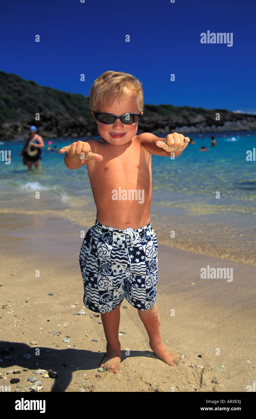 Young boy at Hanauma Bay East Oahu, flashing the shaka sign Stock Photo ...