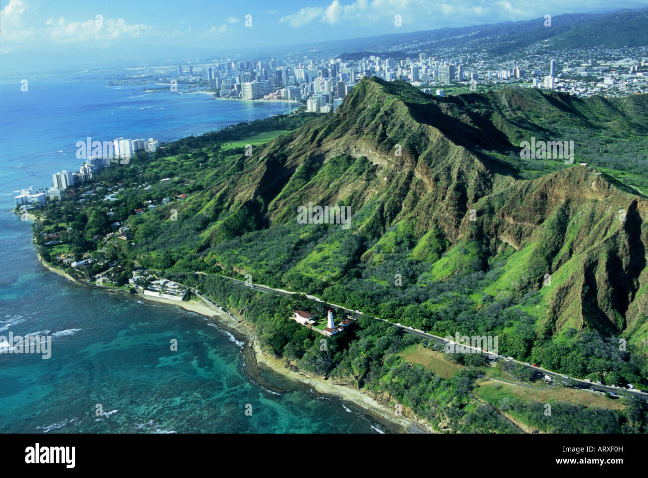 Aerial over Diamond Head, the coastline and the Lighthouse l ooking ...