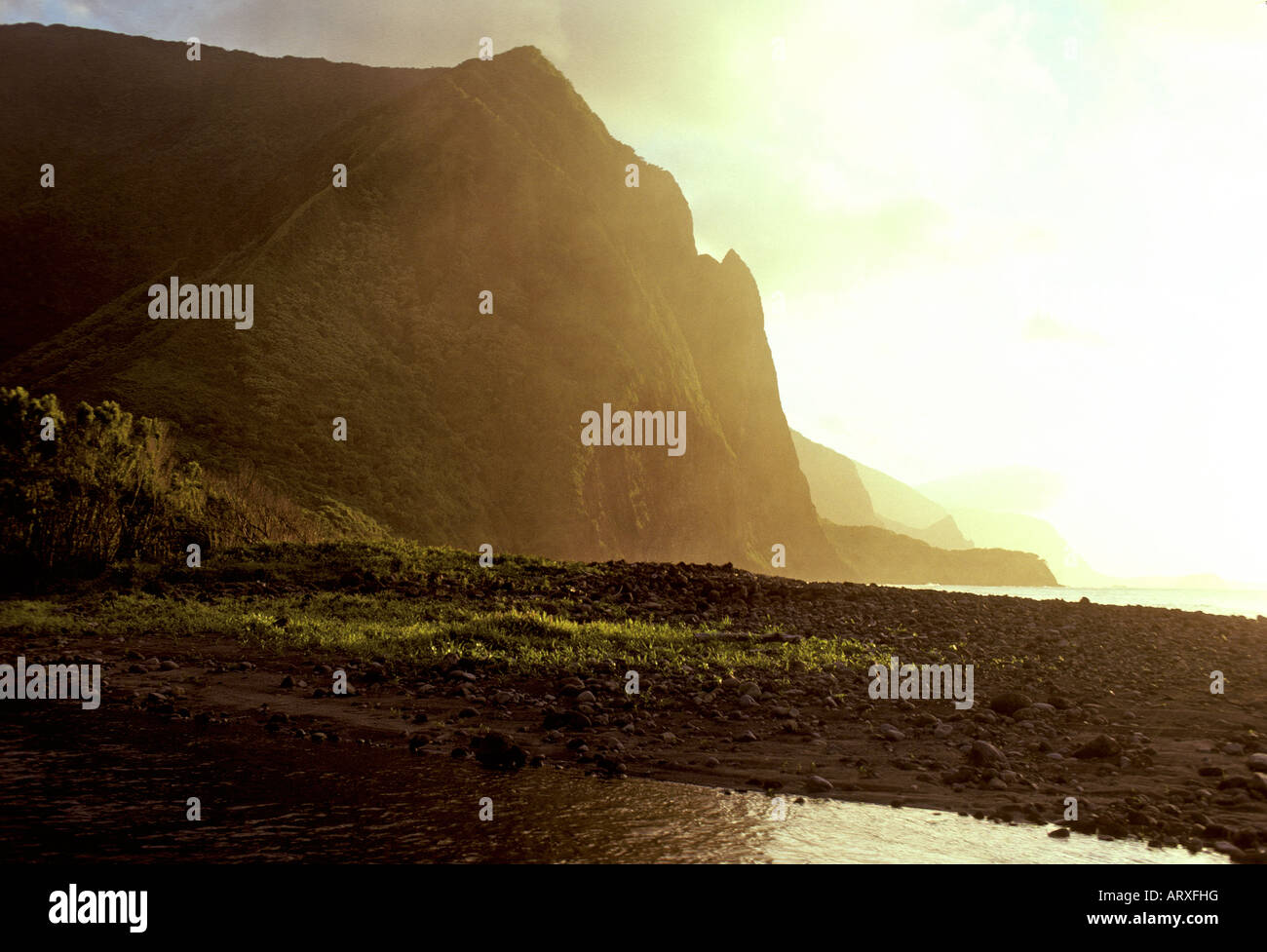 The stunning cliffs of remote Wailau Valley on Molokai glow in the soft ...