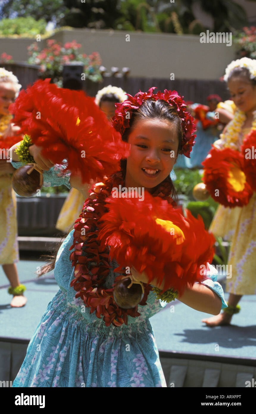 Young hula dancers with feathered uli uli (gourd rattles) & plumeria ...