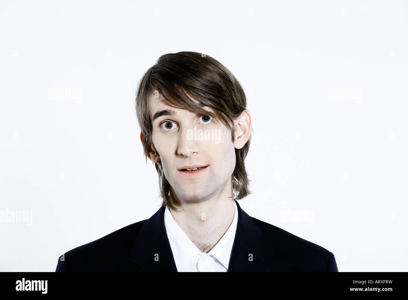 studio shot portrait of a young funny expressive thin and tall man on ...
