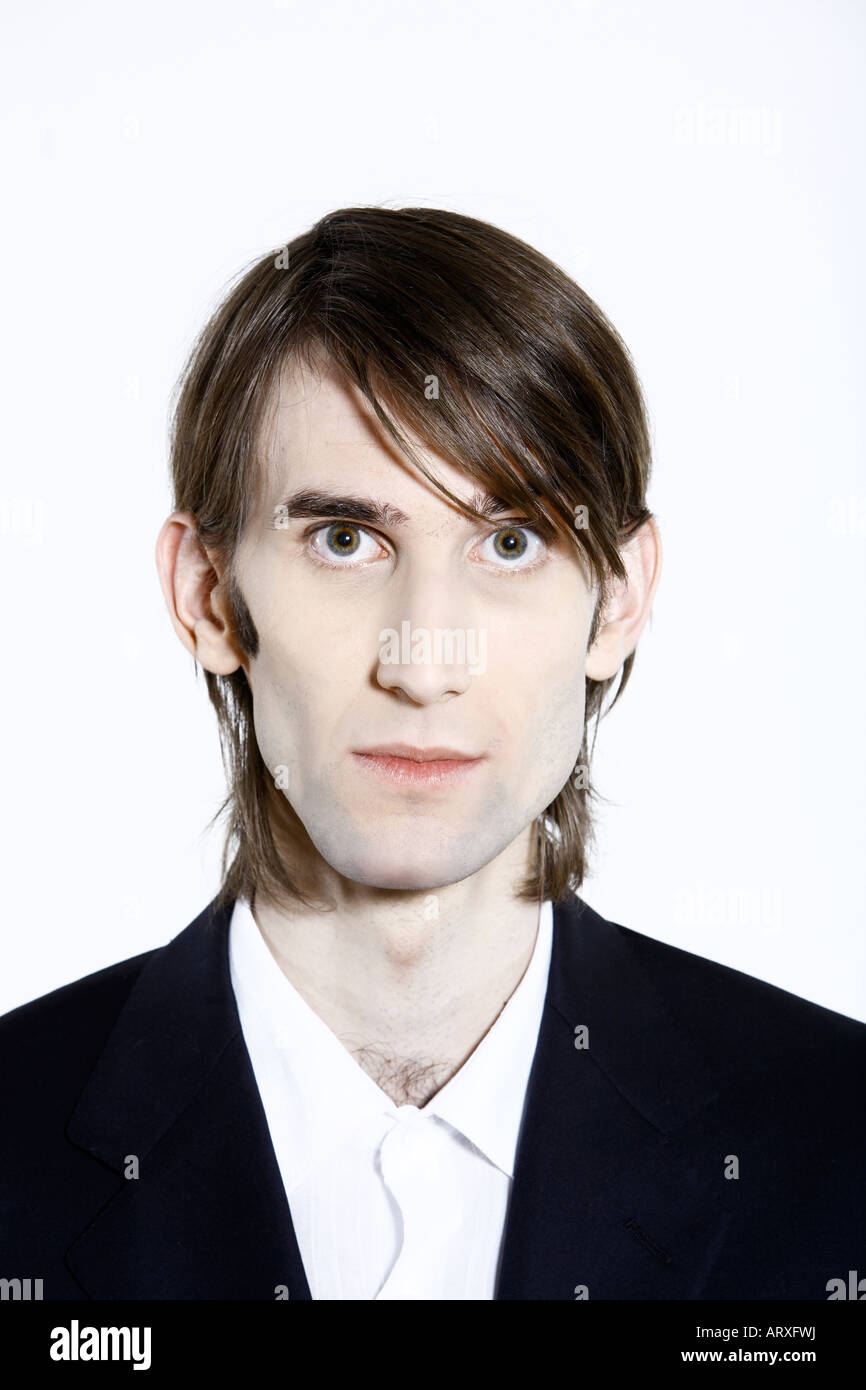 studio shot portrait of a young funny expressive thin and tall man on ...