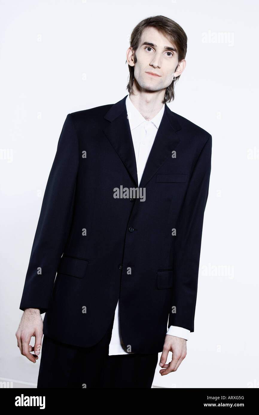 studio shot portrait of a young funny expressive thin and tall man on ...