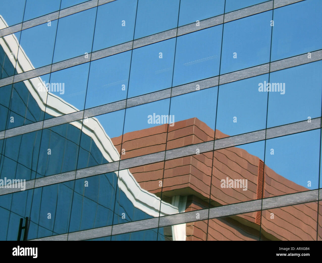 reflection on glass office building Stock Photo - Alamy