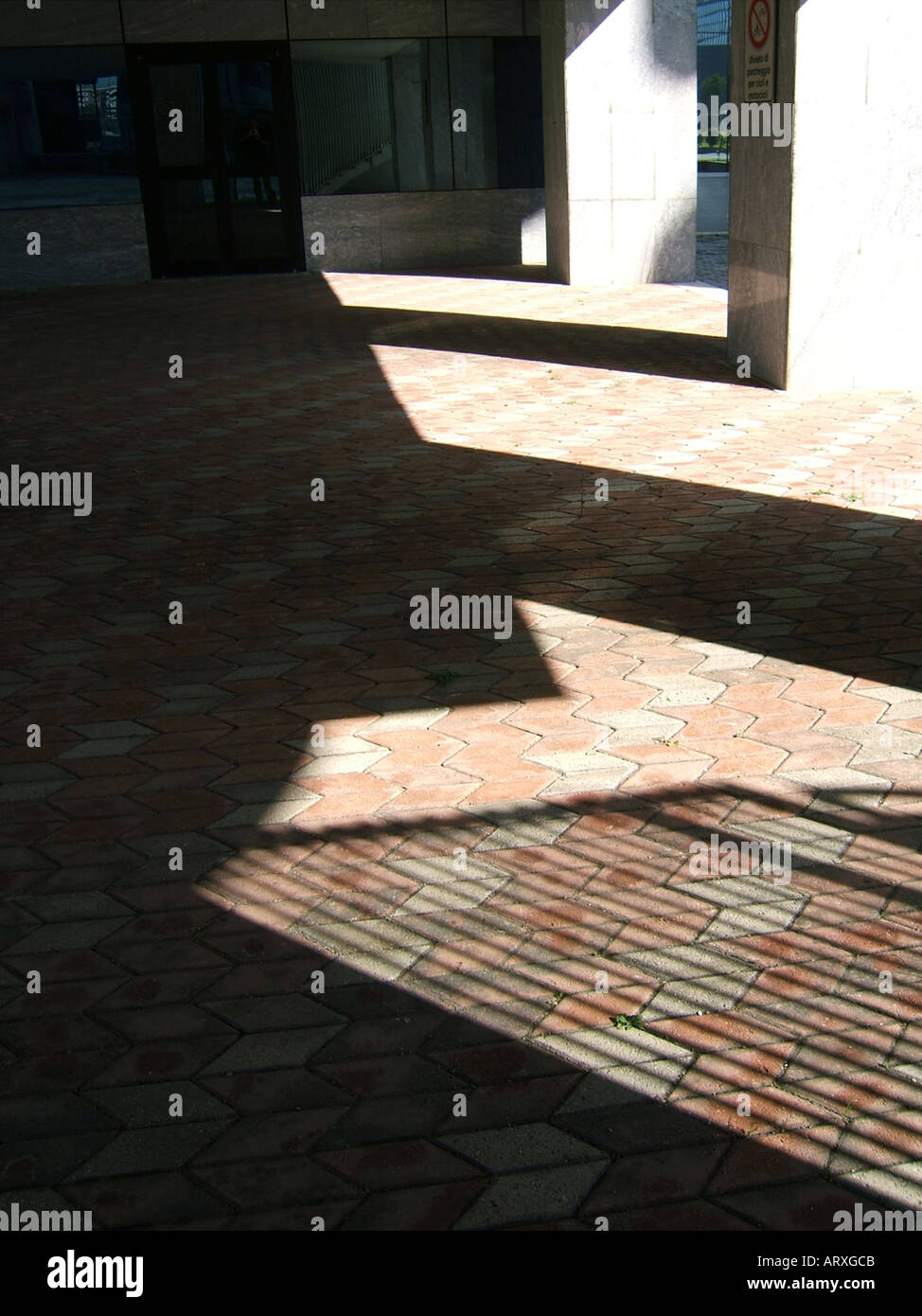 column shadows on tiled pavement Stock Photo - Alamy