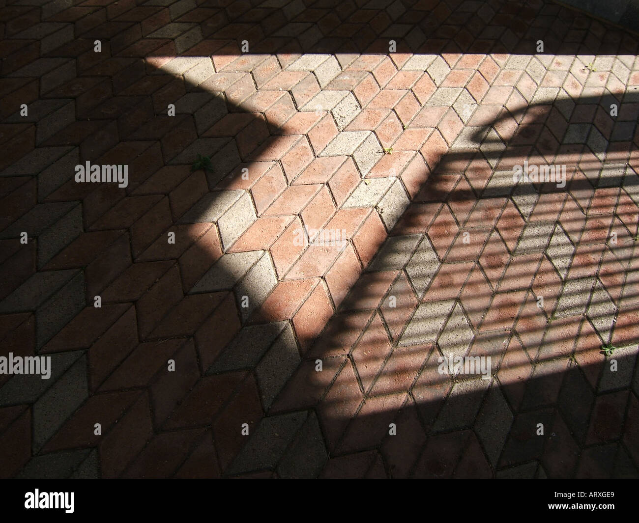 column shadows on tiled pavement Stock Photo - Alamy