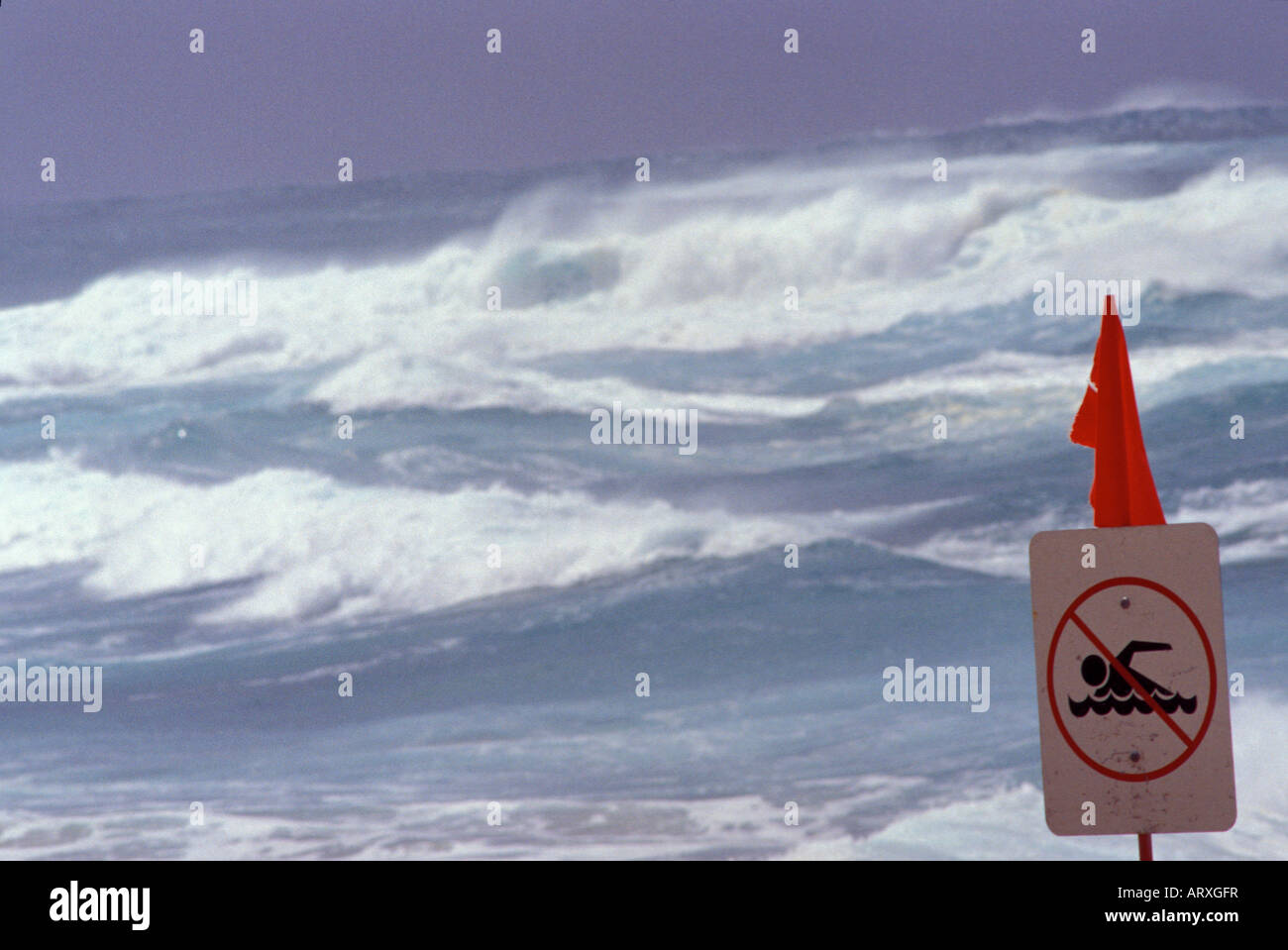 North Shore Oahu high winter surf danger sign big waves Stock Photo - Alamy