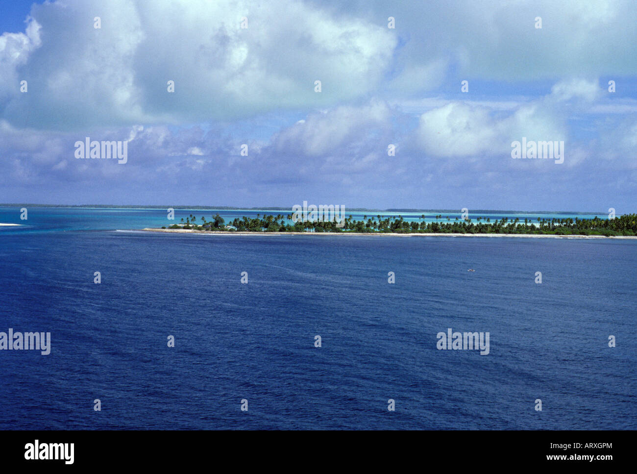 Fanning atoll, deep ocean, shallow lagoon, green tint to cloud bottoms ...