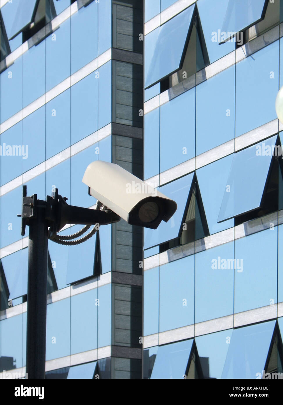 glass office blocks and cctv camera Stock Photo - Alamy