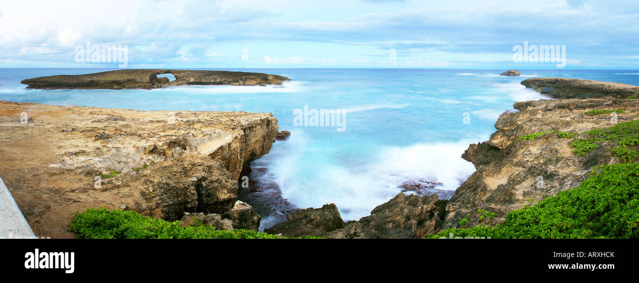 Waves crash against Laie point. Puka rock visible in the background ...