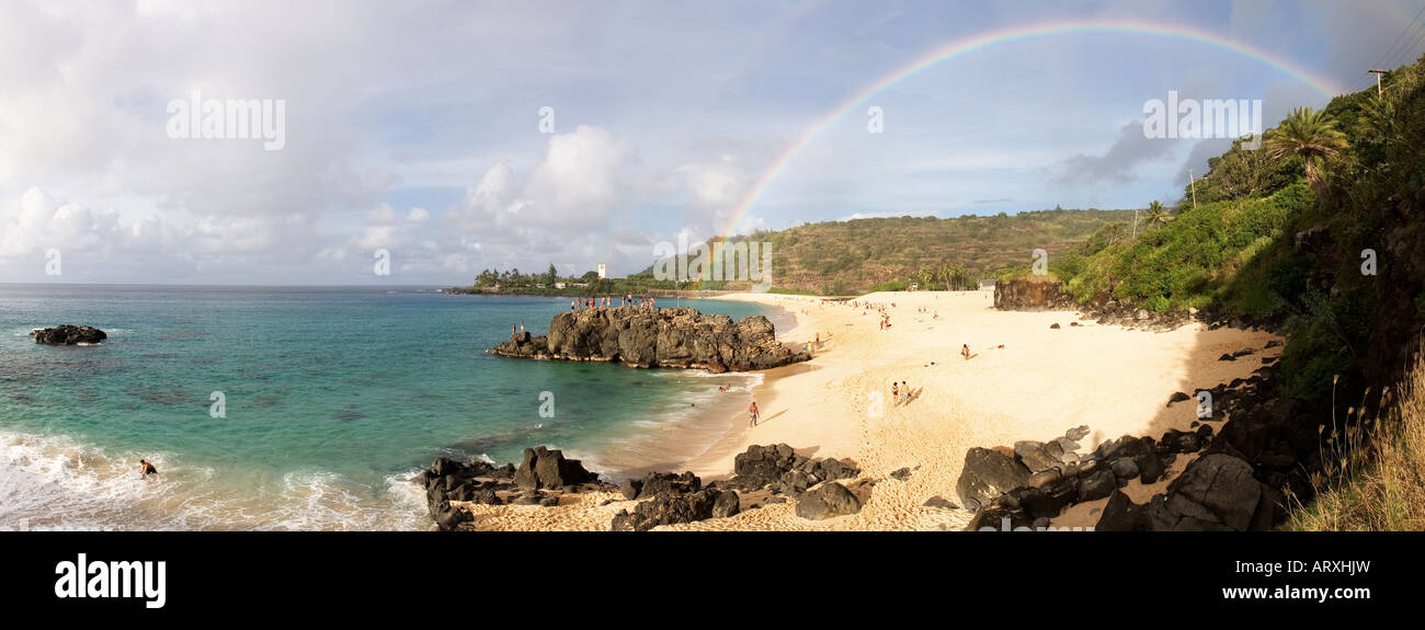 Double rainbow at Waimea bay. Wide angle panoramic shot. Jumping rock ...