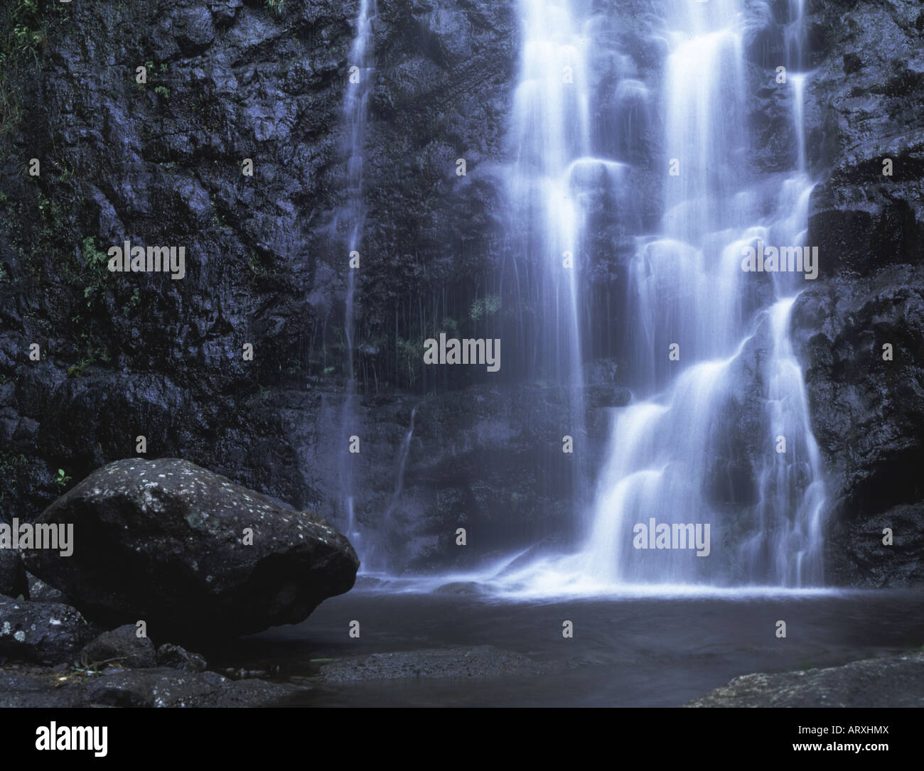 Boulder and waterfall, Palolo valley Stock Photo - Alamy