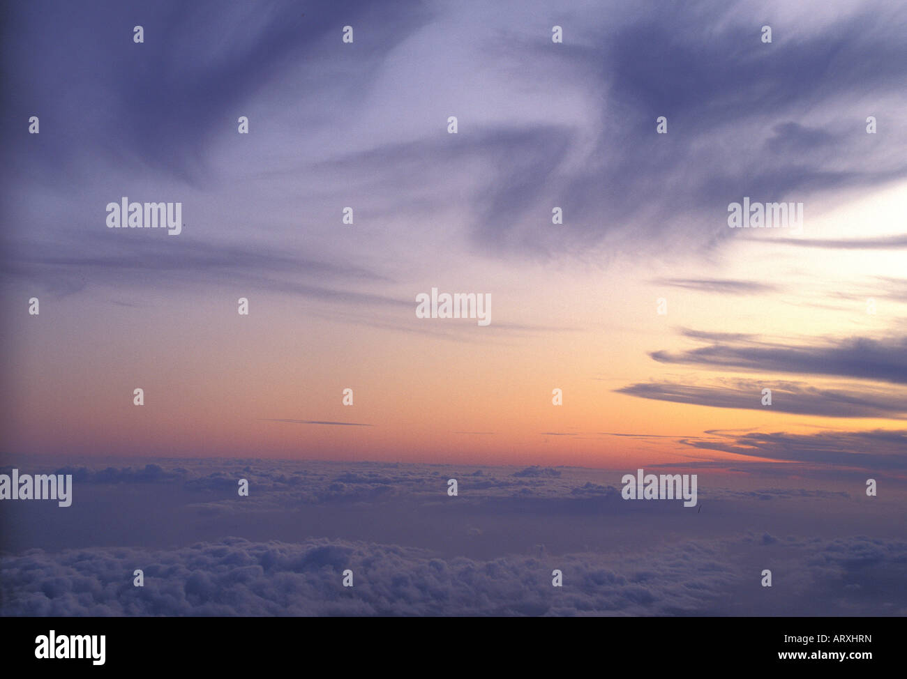 Clouds and sunset out of an airplane window Stock Photo - Alamy
