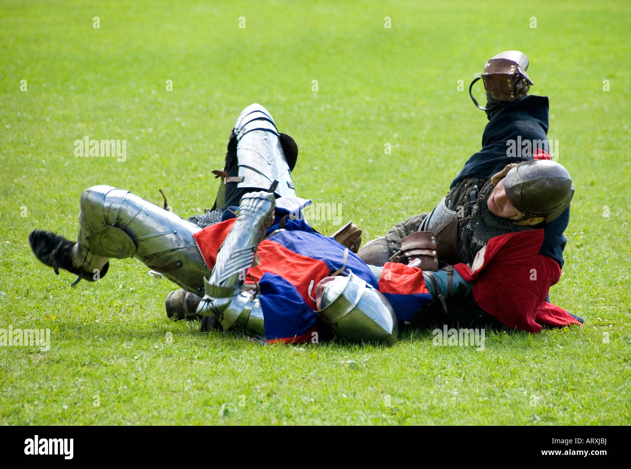 Two Knights in Armour Fighting Hand to Hand Rolling Around on Floor of ...