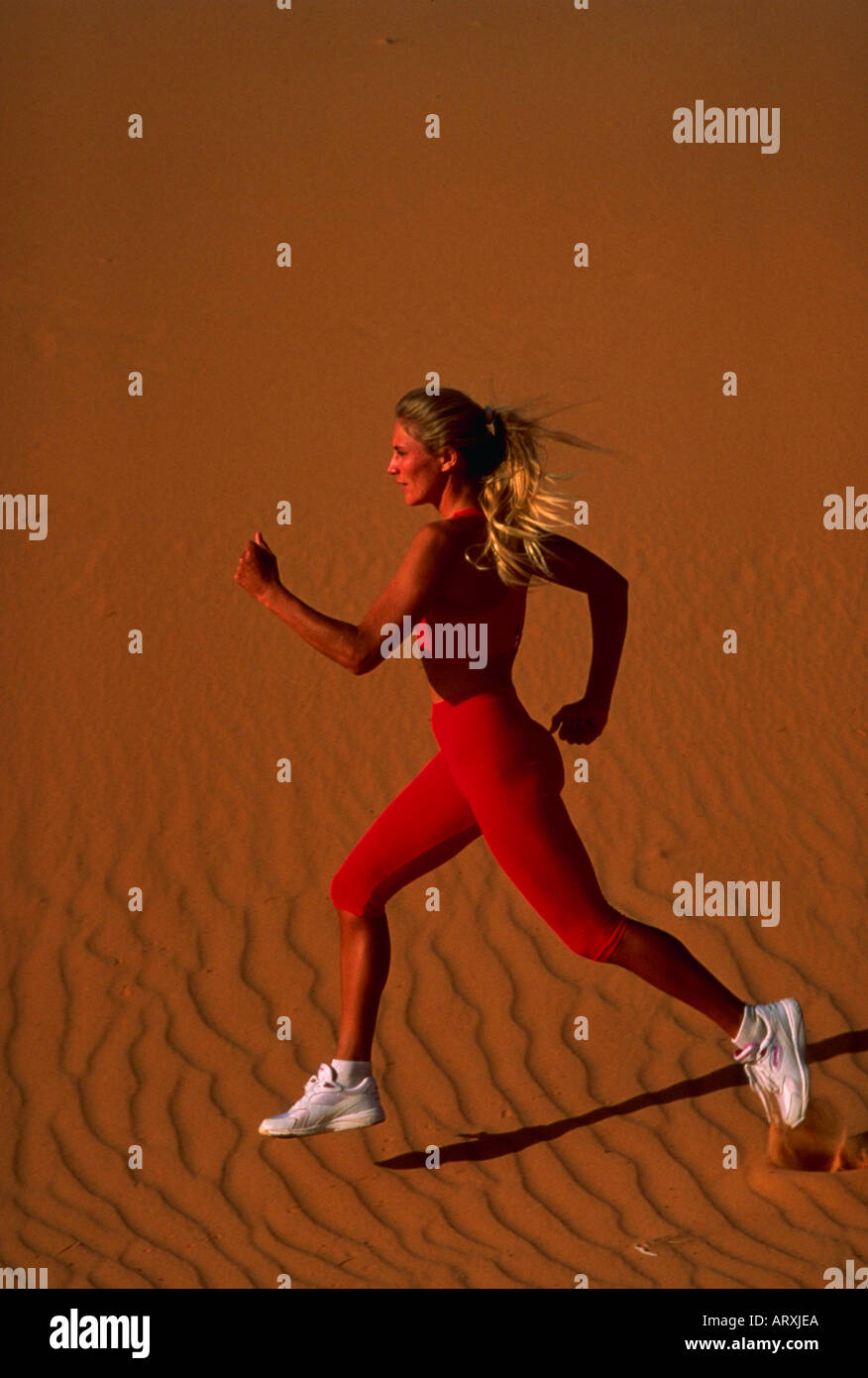 Runner on sand Stock Photo - Alamy