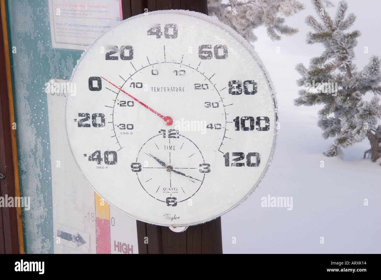 Thermometer registering bitter cold temperatures 4 degrees Farenheit on ...