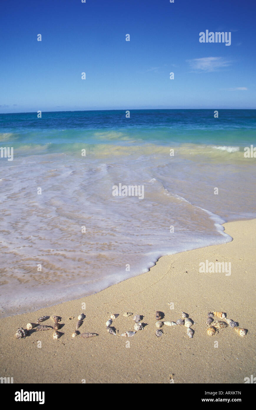 Aloha written in sand with sea shells on white sandy beach Stock Photo ...