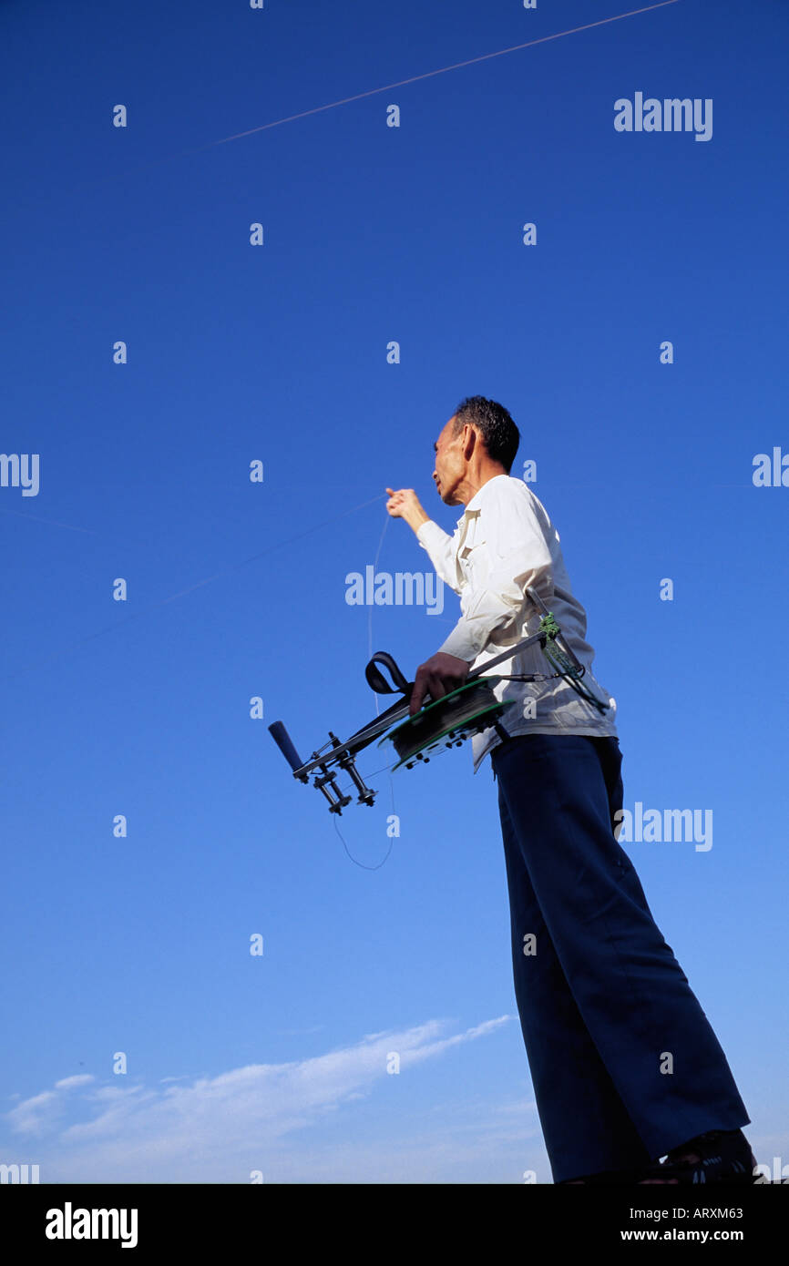 Evening kite flying at the Sun Tower in Jianshui Yunnan China 2004 ...
