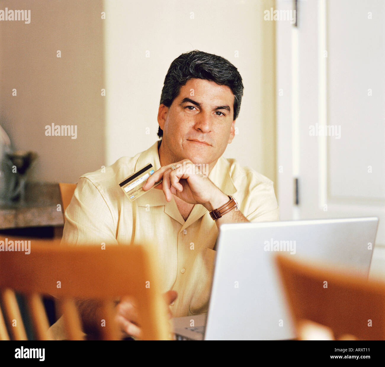 Hispanic Man Buying Products on Internet with Credit Card Stock Photo ...