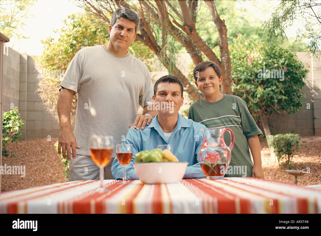 Hispanic Three Generations of Men at Picnic Stock Photo - Alamy