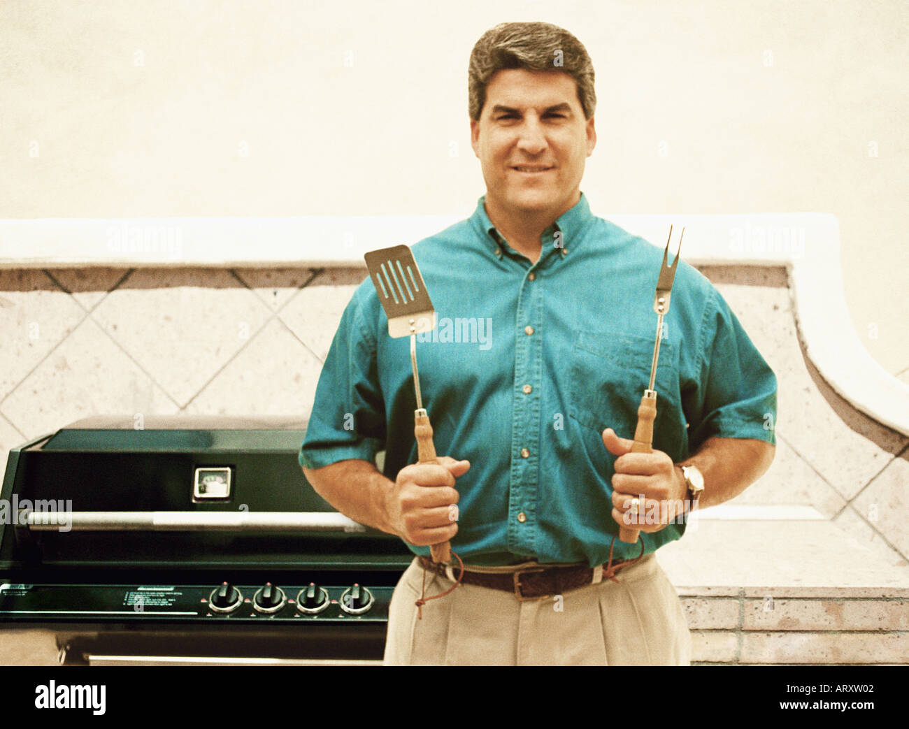 Latino Man with BBQ, Barbeque Stock Photo - Alamy