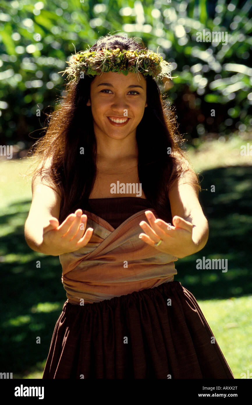 Smiling Hawaiian hula dancer in a park in Honolulu on Oahu, dancing ...