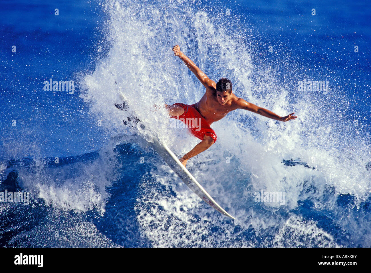 Surfer Ola Eleogram flies over exploding white water of a breaking wave ...