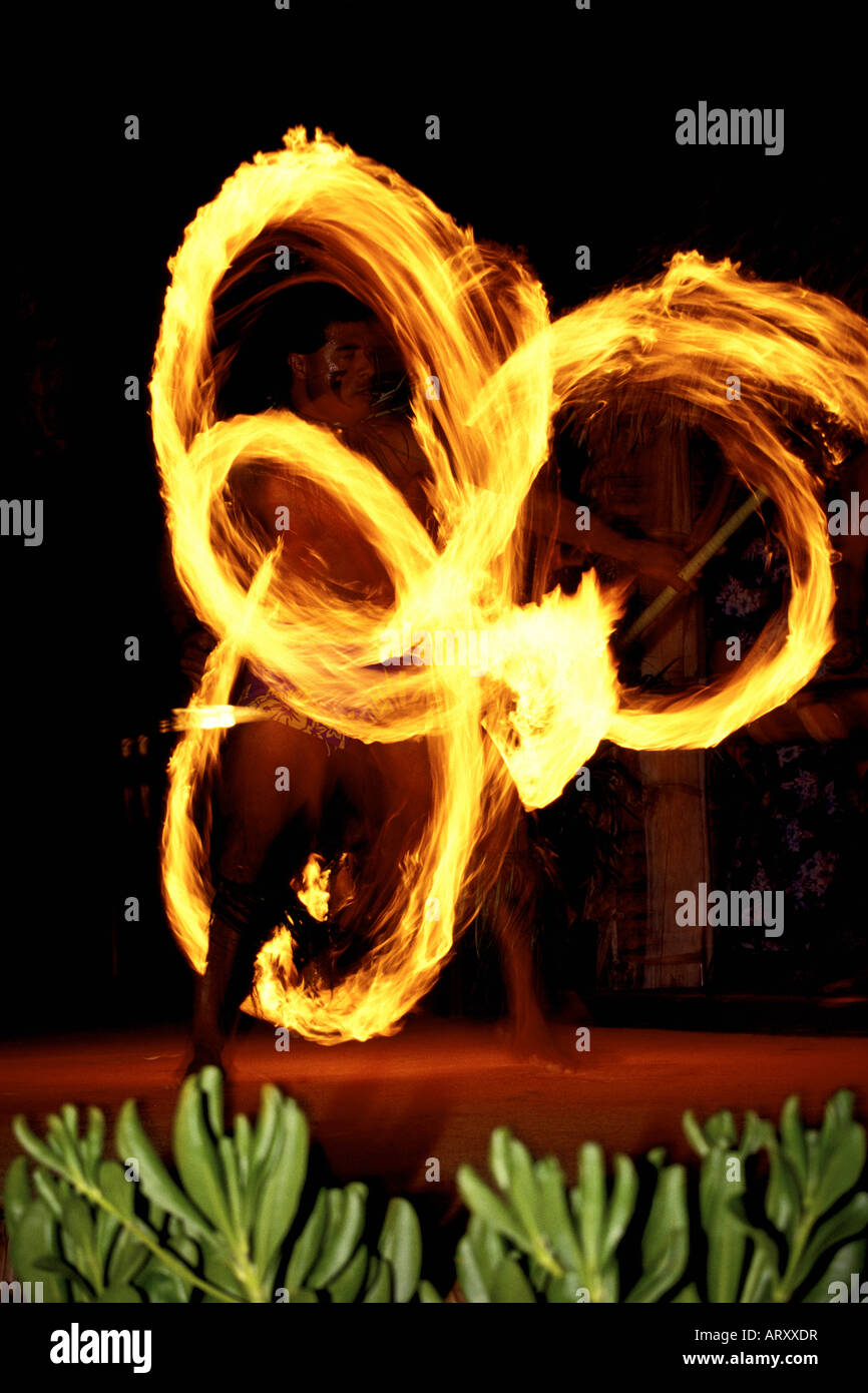 Spectacular Polynesian fire dancer entertains tourists at a luau on the ...