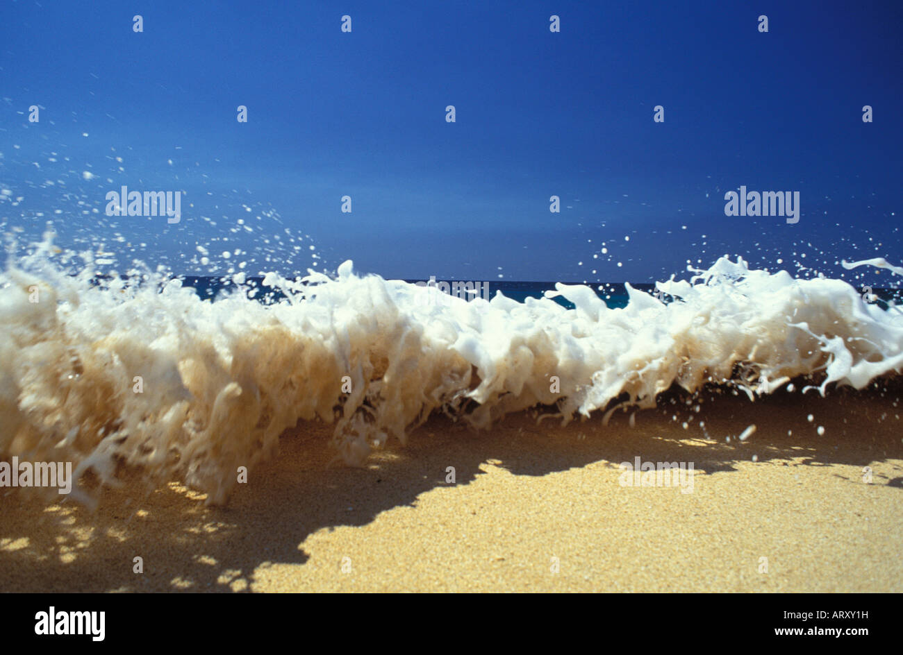 Water rushing to shore at ehukai beach park on the north shore of Oahu ...