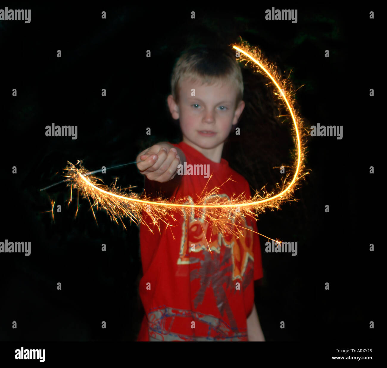 Boy Using A Firework Sparkler To Paint With Light Stock Photo - Alamy