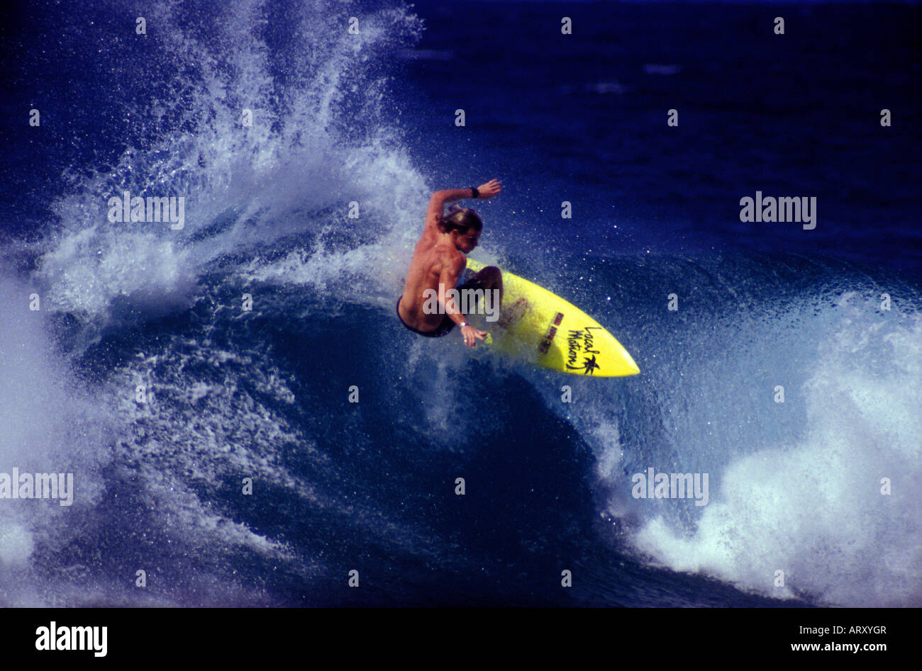 Surfer riding a wave off Rocky Point on the North Shore of Oahu Stock ...