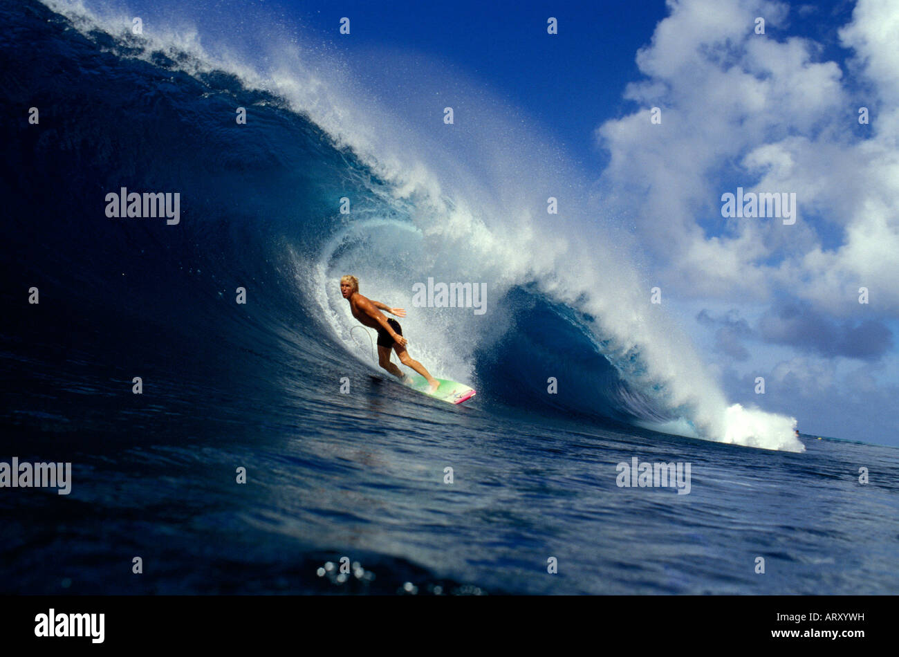 Man surfing the legendary waves off the North Shore of Oahu Stock Photo ...