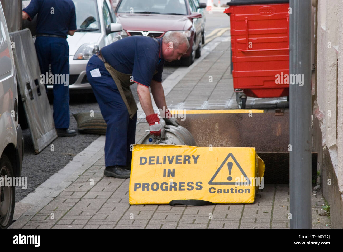 Delivery of beer casks to pub cellar Stock Photo - Alamy