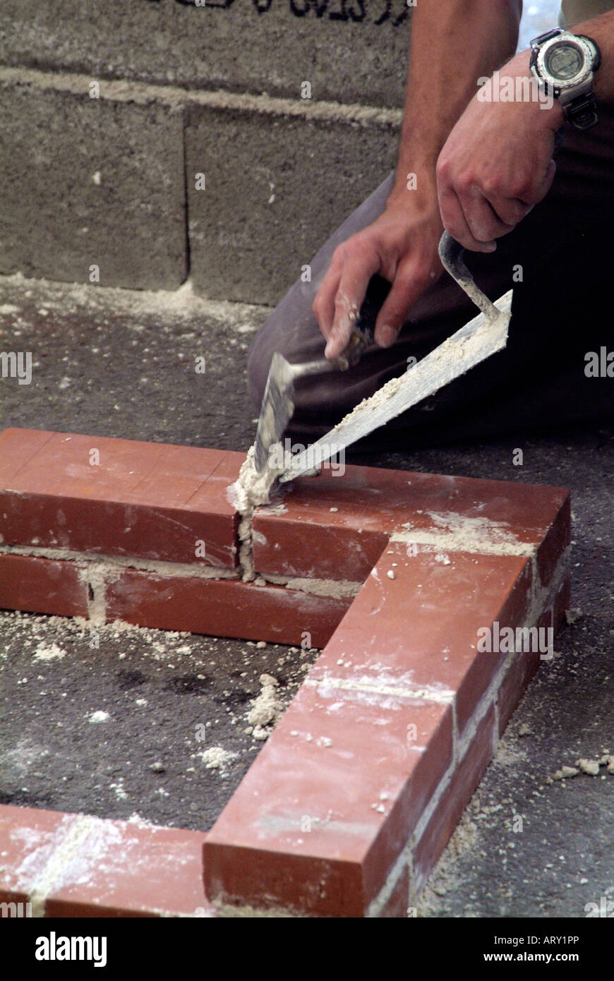 bricklayer brick bricklaying building construction Stock Photo - Alamy