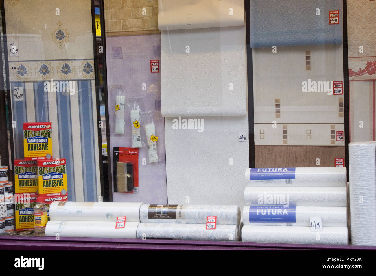 Rolls of wallpaper in the window of a DIY hardware shop Stock Photo - Alamy