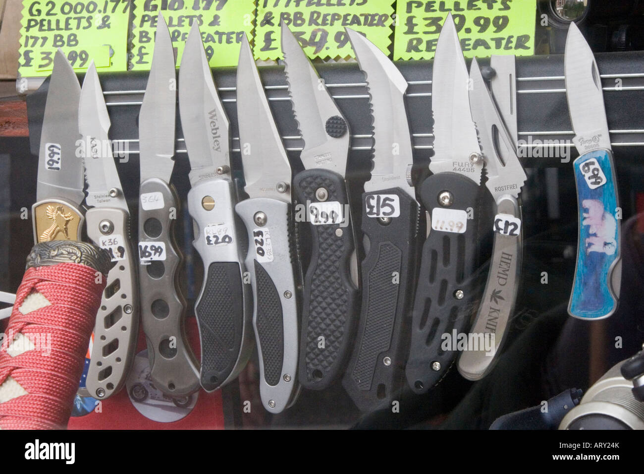 Decorated knives for sale in a shop window display Stock Photo - Alamy
