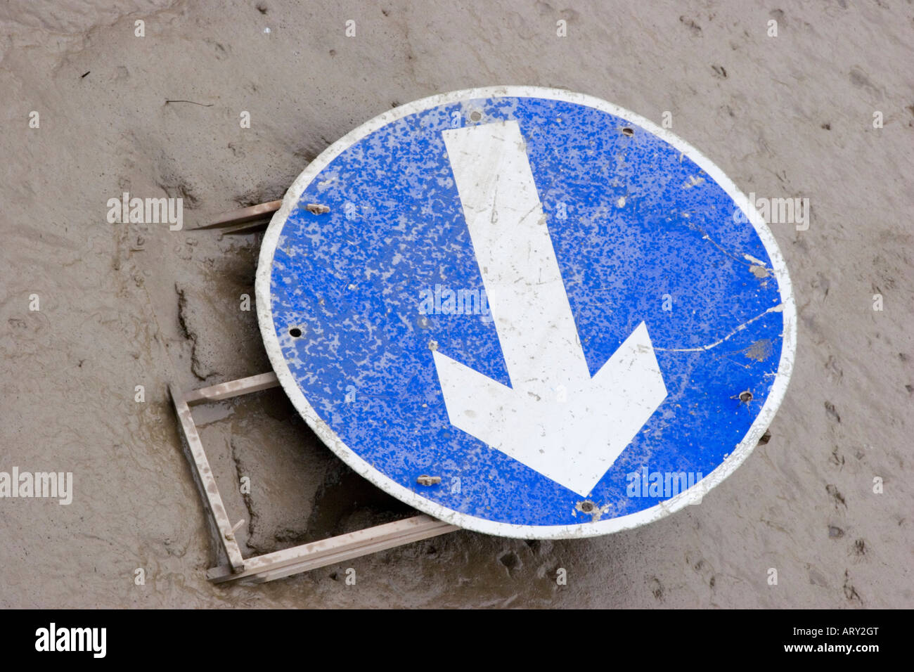 Road sign thrown into the silt and mud of the River Usk in Newport ...
