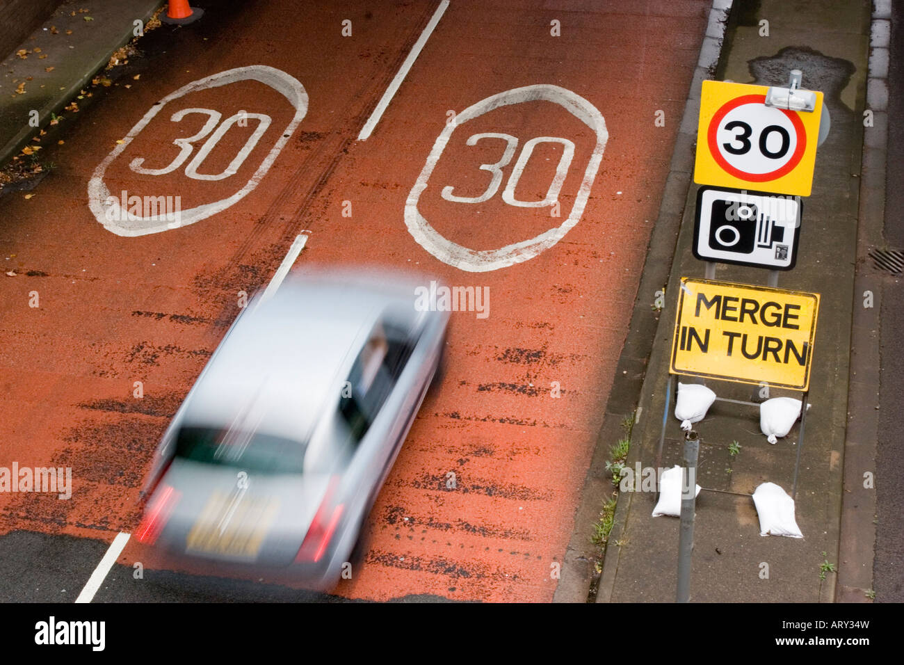Merge in turn in 30mph speed limit zone with speed cameras operating ...