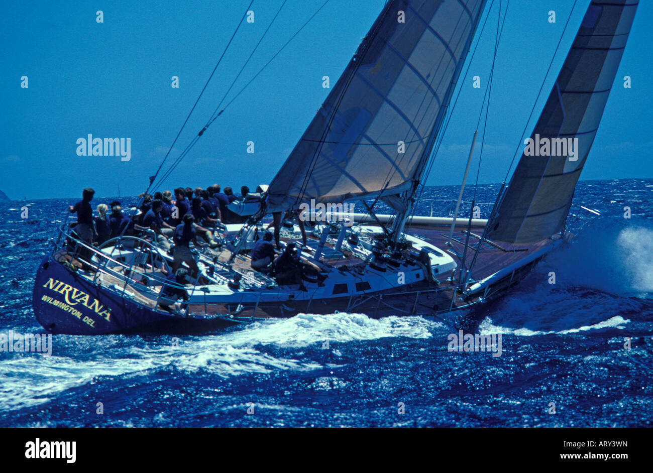 Sailboat and its crew sailing on deep blue ocean during the Clipper cup ...