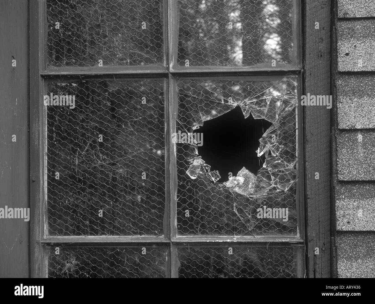 Broken glass window in Black and White Stock Photos & Images - Alamy