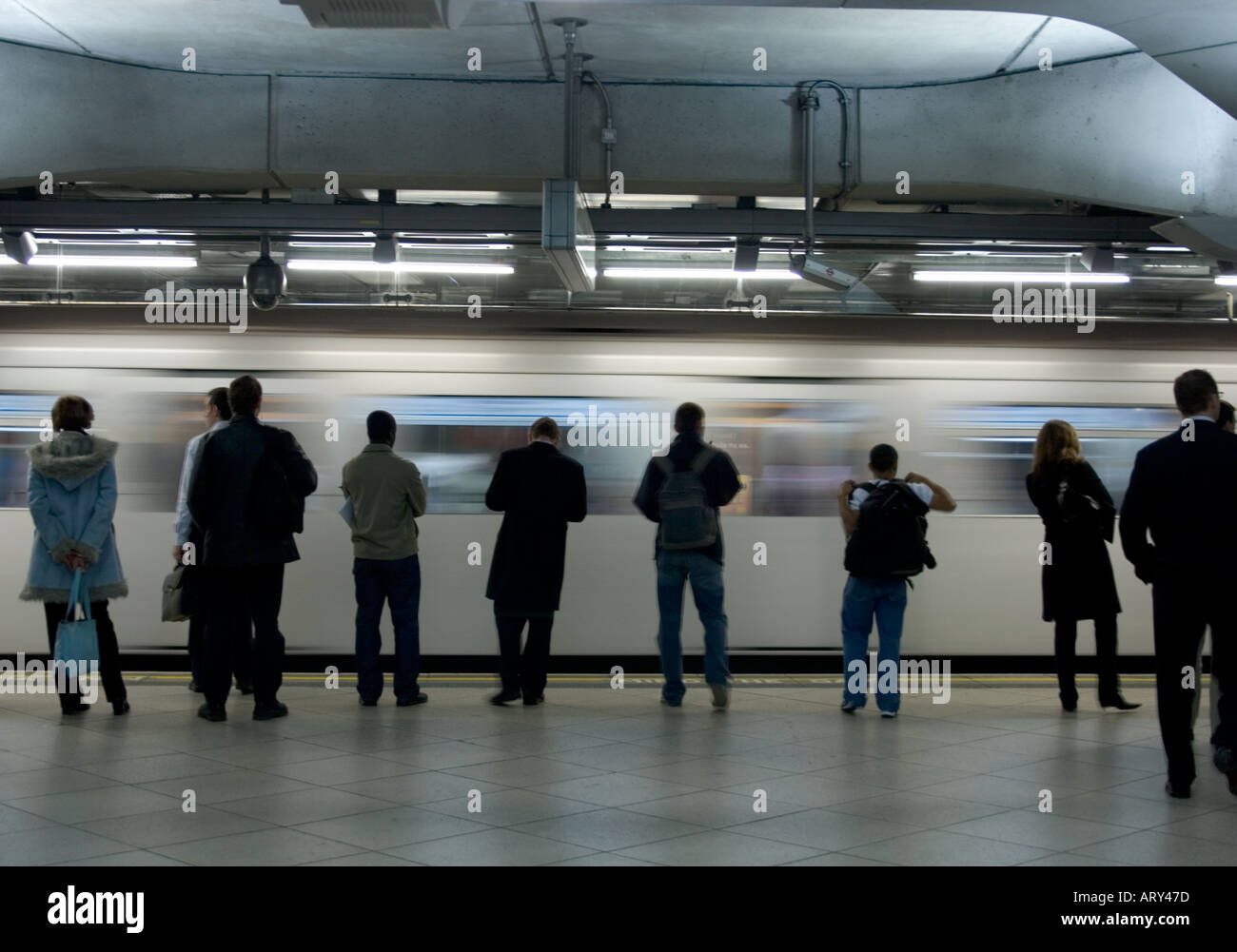 Tube train entering station on the london underground tube network ...