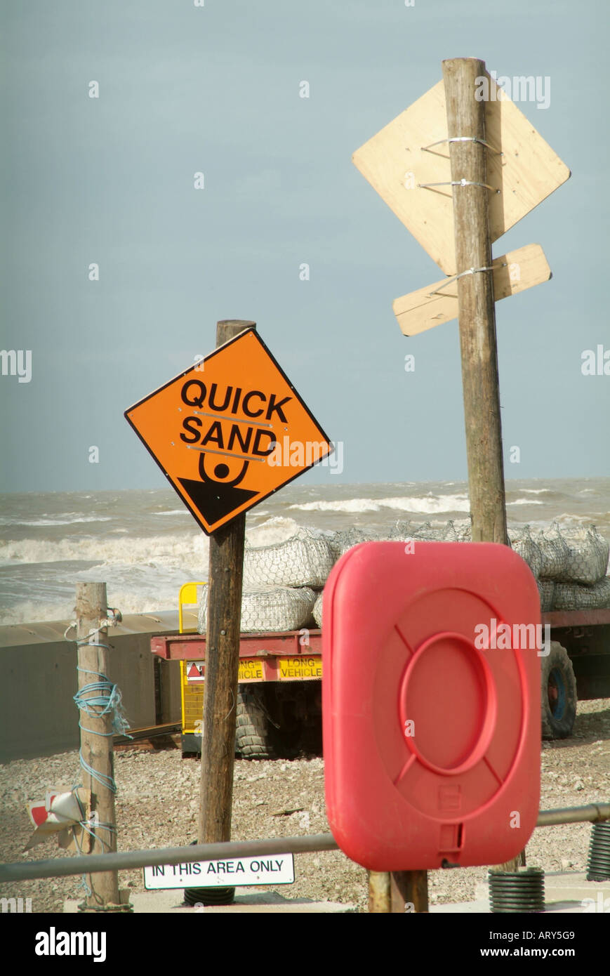 quick, sand, sign, beach, caution, danger Stock Photo - Alamy