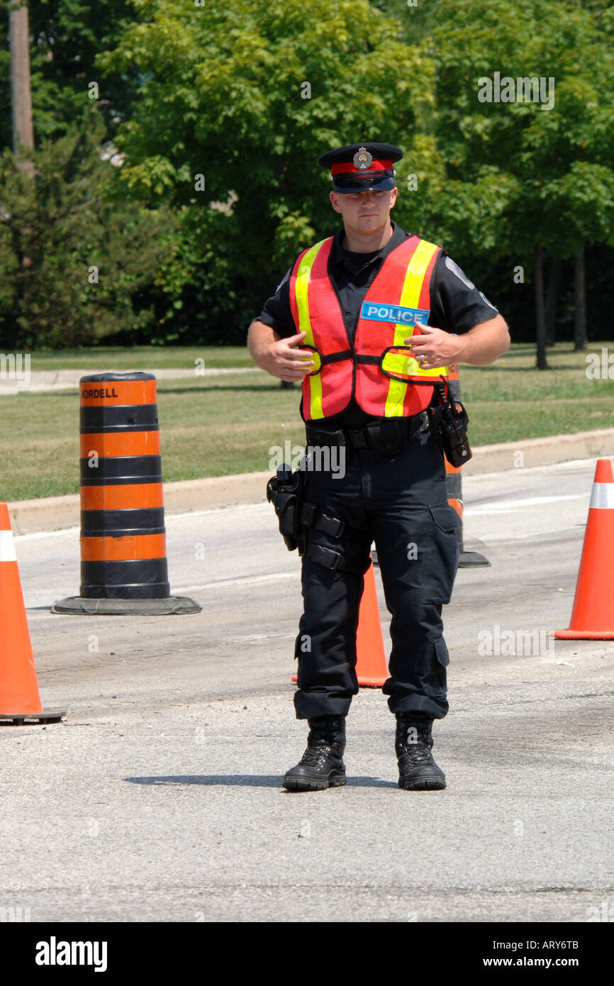 Canadian Police Officer on Traffic Duty wearing a high-visibility vest ...